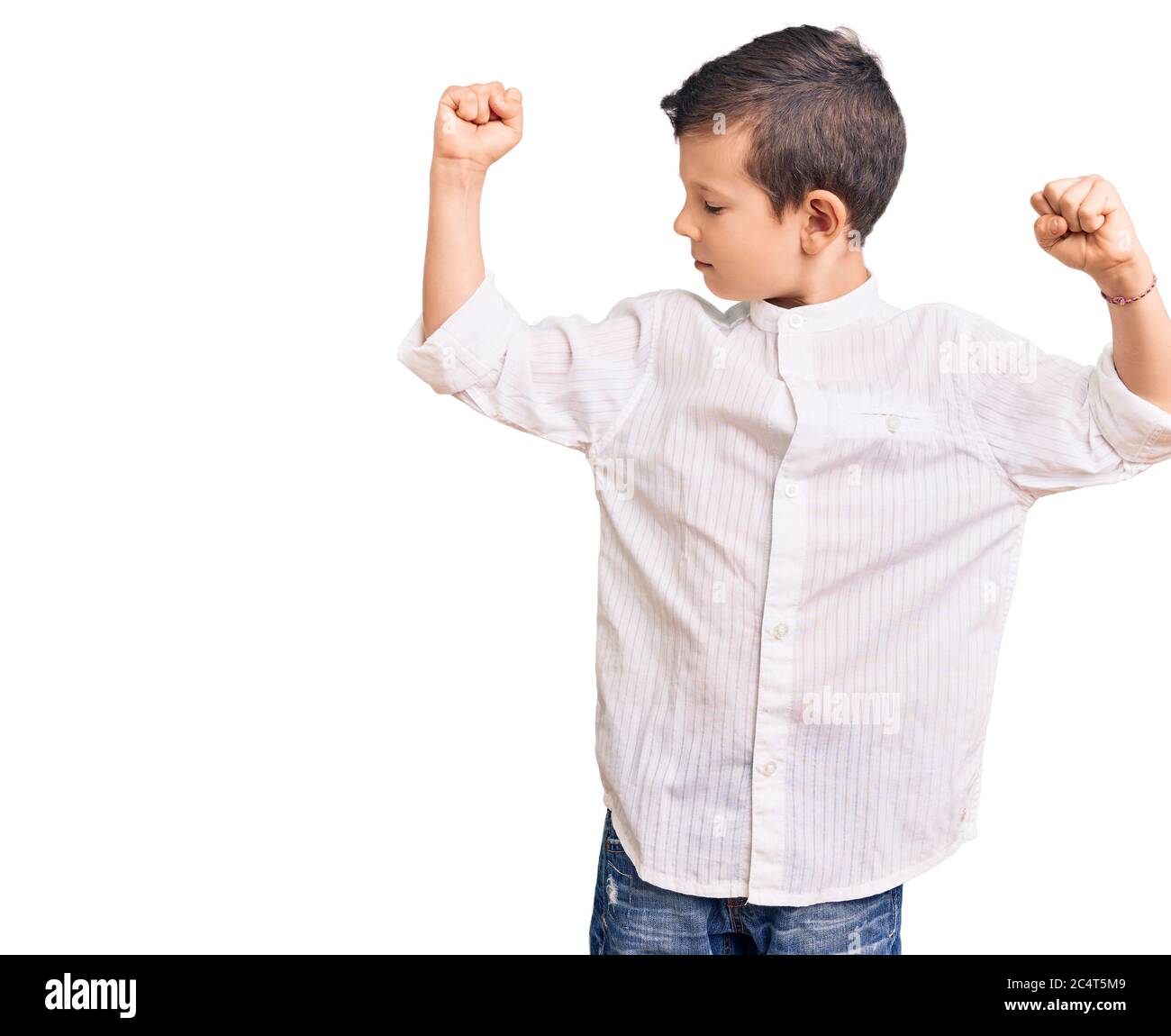 Cute blond kid wearing elegant shirt showing arms muscles smiling proud ...