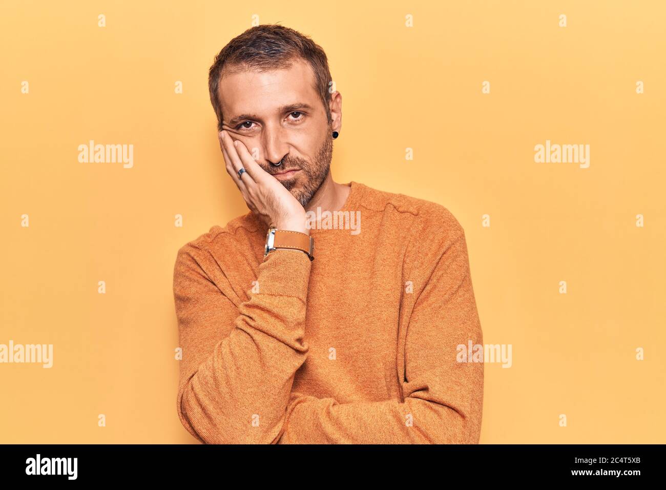 Young handsome man wearing casual clothes thinking looking tired and ...