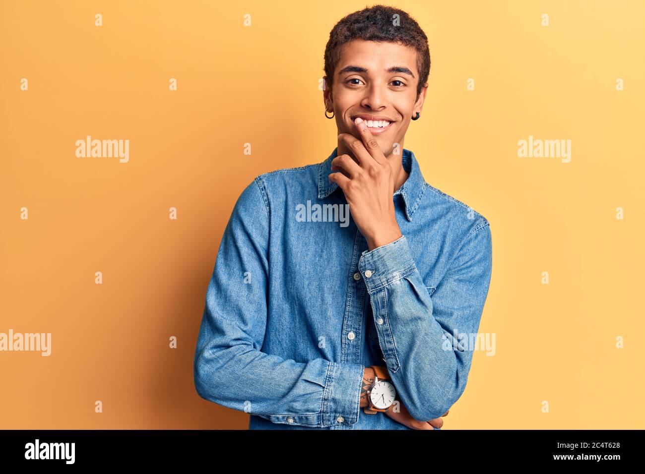 Young african amercian man wearing casual clothes smiling looking ...