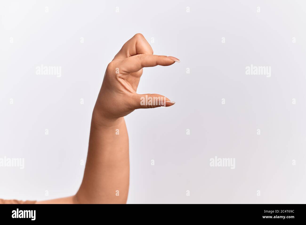 Hand of caucasian young woman picking and taking invisible thing ...