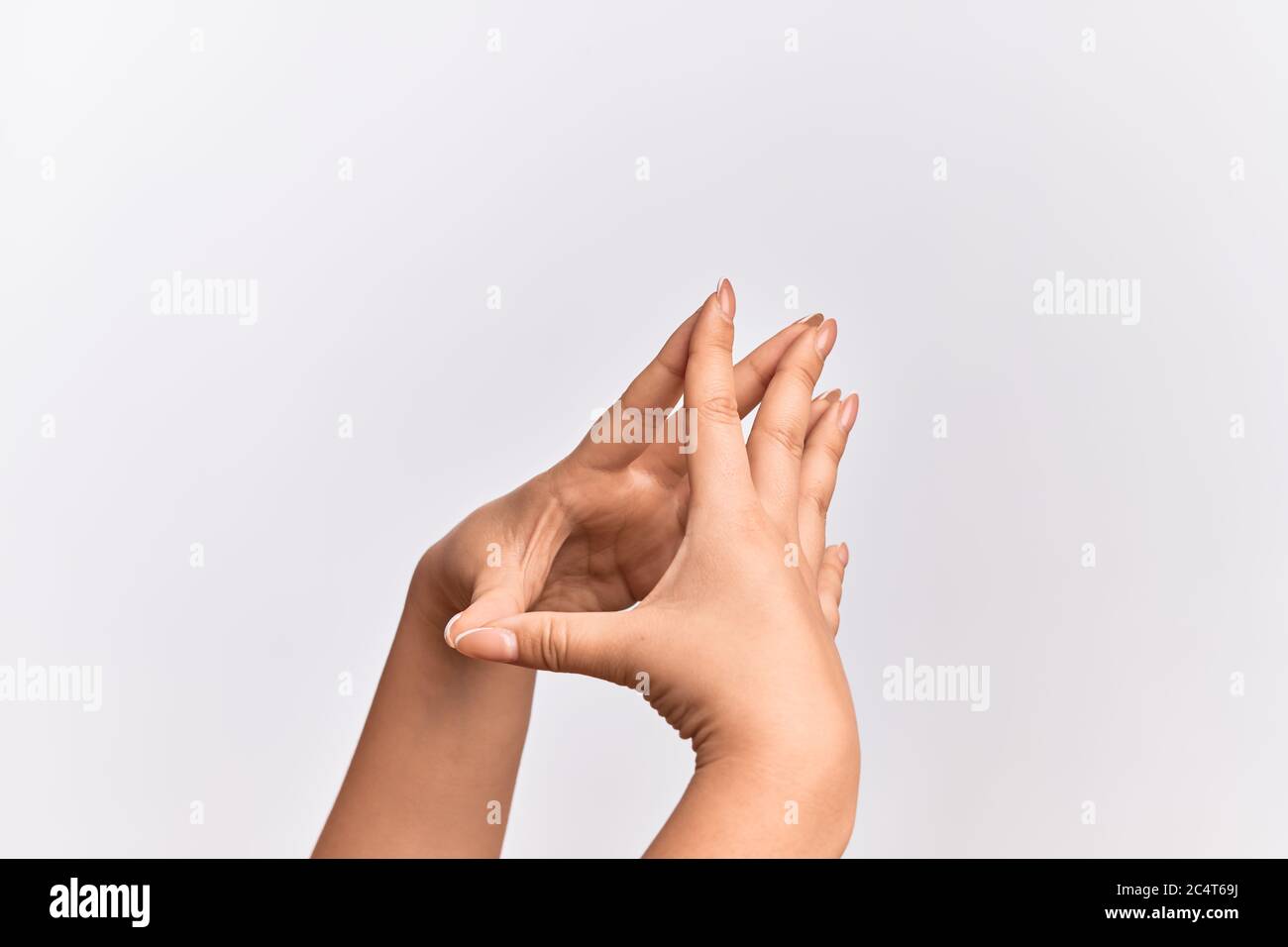 Hand of caucasian young woman touching fingertips of both hands ...