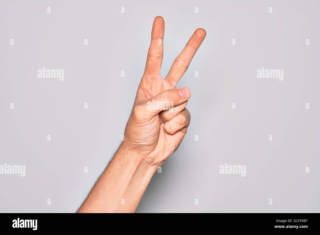 Hand of caucasian young man showing fingers over isolated white ...