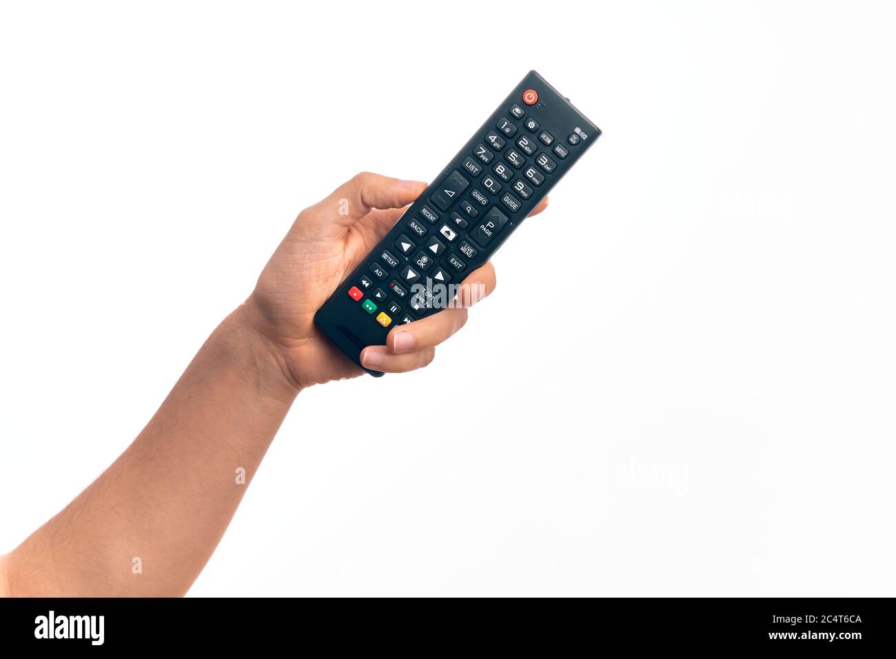 Hand of caucasian young man changing tv channel holding remote control ...