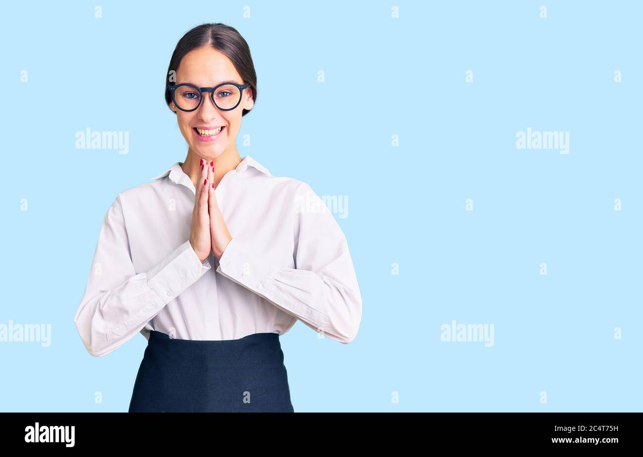 Beautiful brunette young woman wearing professional waitress apron ...