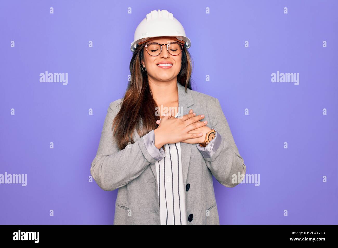 Professional woman engineer wearing industrial safety helmet over ...