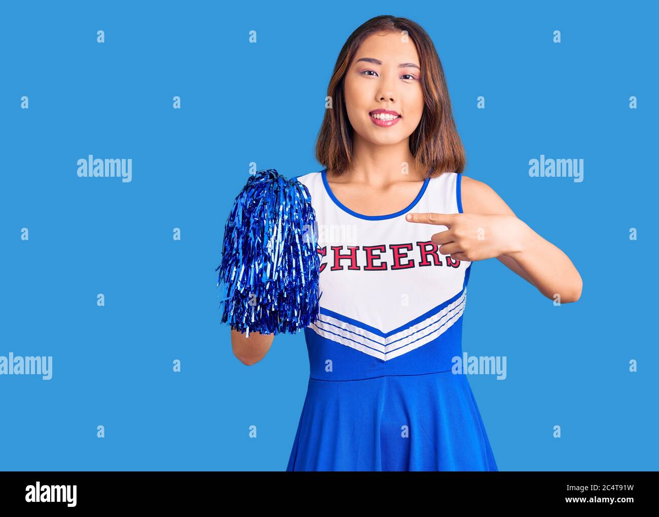 Young Beautiful Chinese Girl Wearing Cheerleader Uniform Holding Pompom