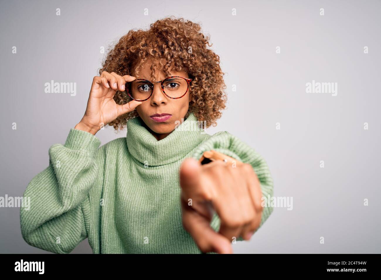 African american optical woman with curly hair wearing glasses over ...