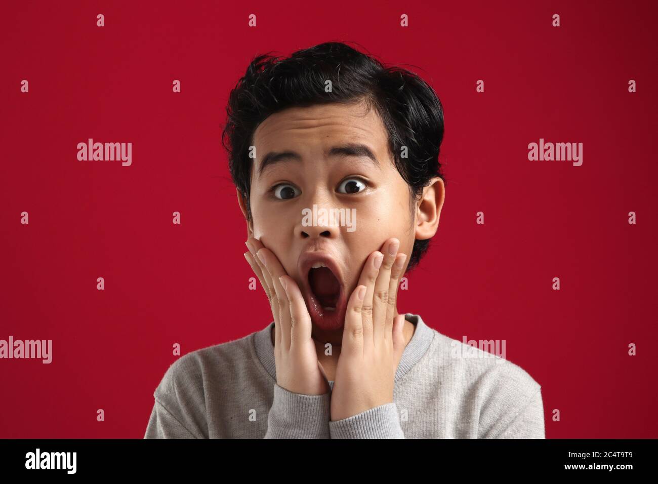 Asian teen boy shocked expression hi-res stock photography and images ...