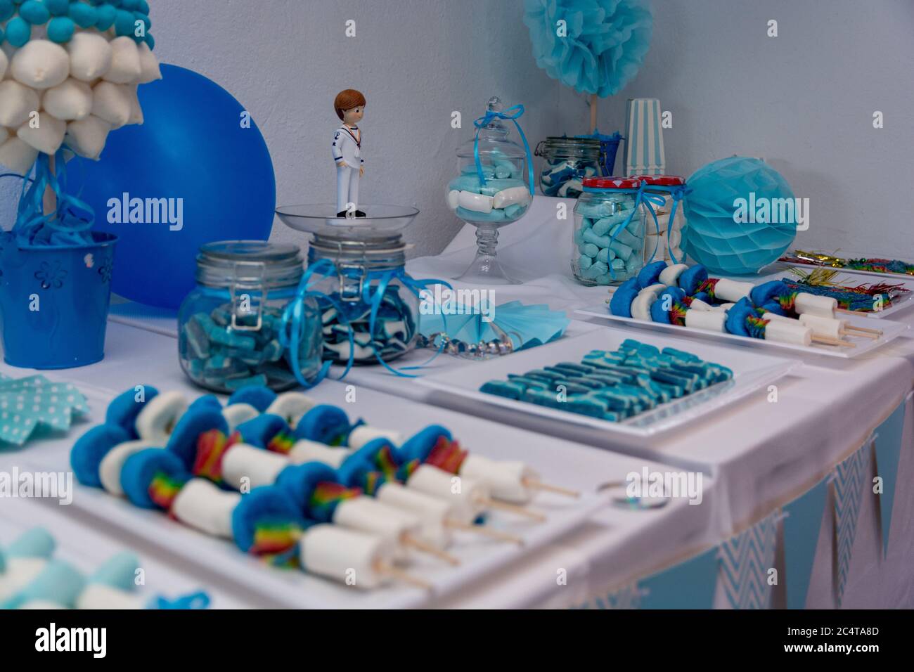 Birthday sailor-themed table setting with sweet decorations and a ...