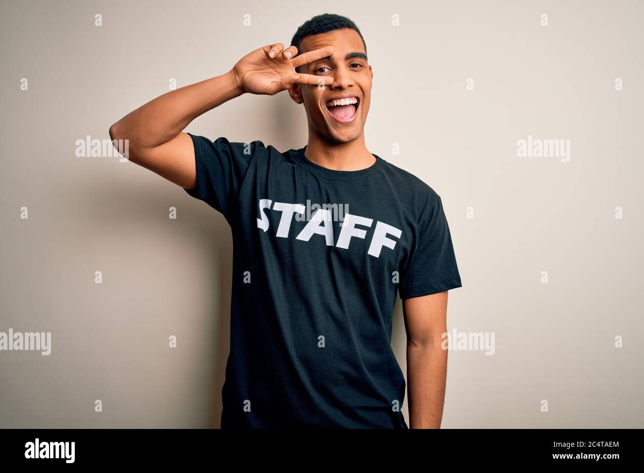 Young handsome african american worker man wearing staff uniform over ...