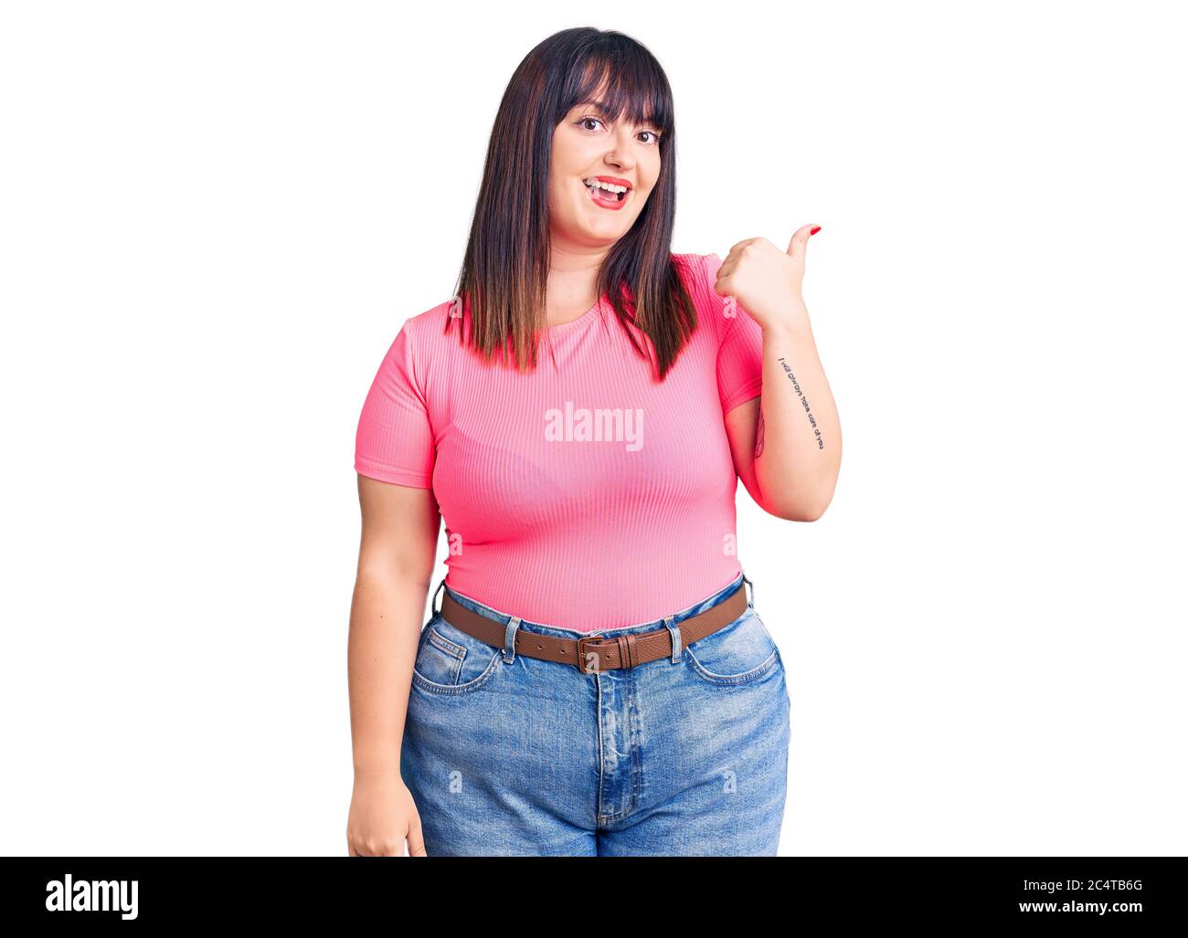 Young plus size woman wearing casual clothes smiling with happy face ...