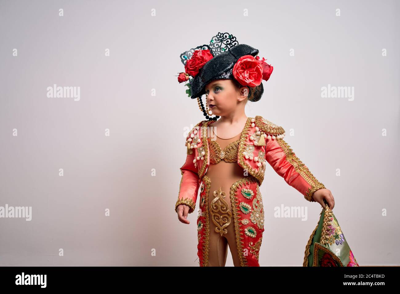 Young little caucasian kid girl wearing bullfighter traditional folkore ...