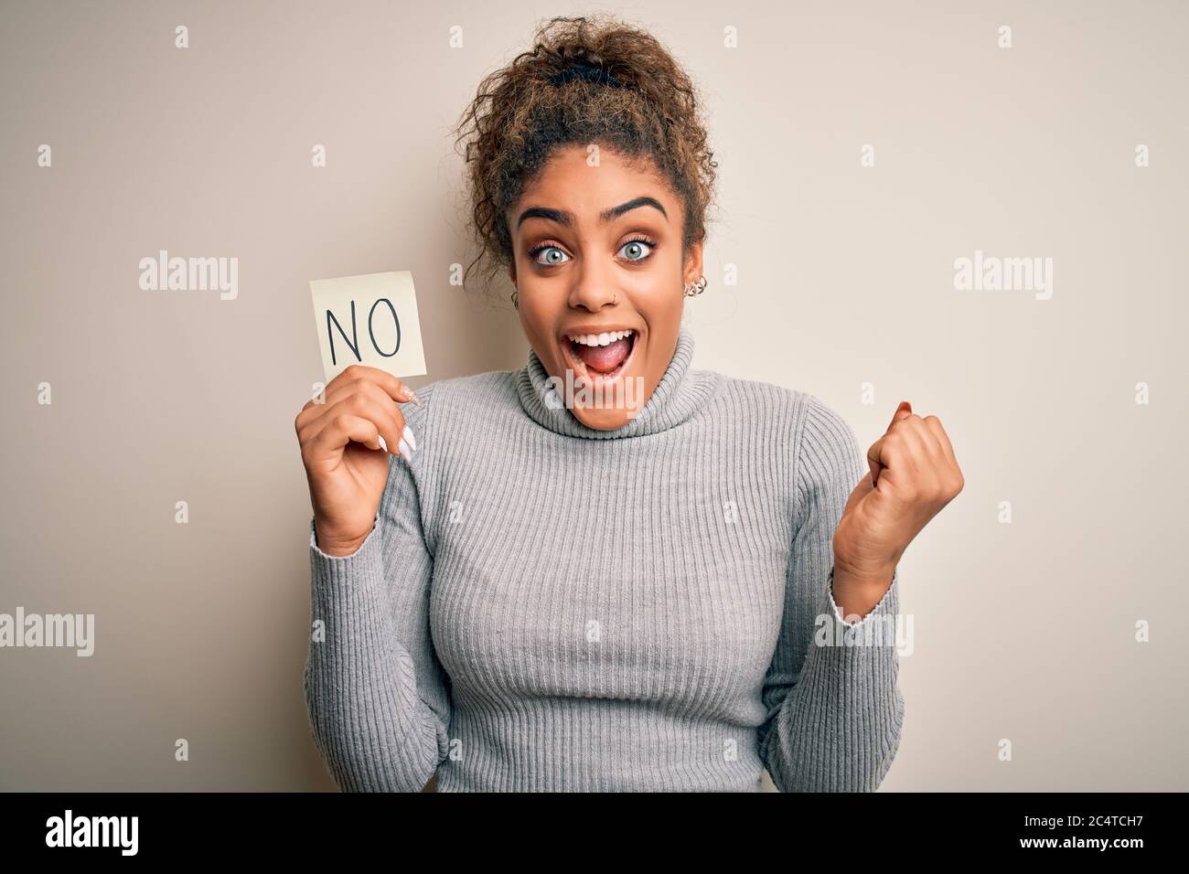Young african american girl holding reminder paper with no word ...