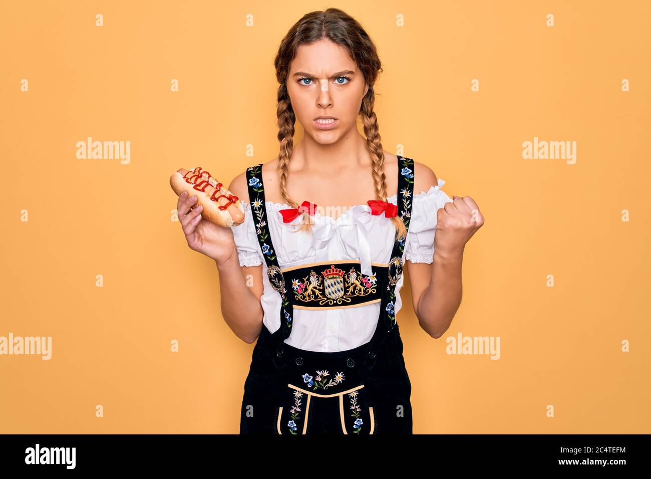 Beautiful blonde german woman with blue eyes wearing oktoberfest dress ...