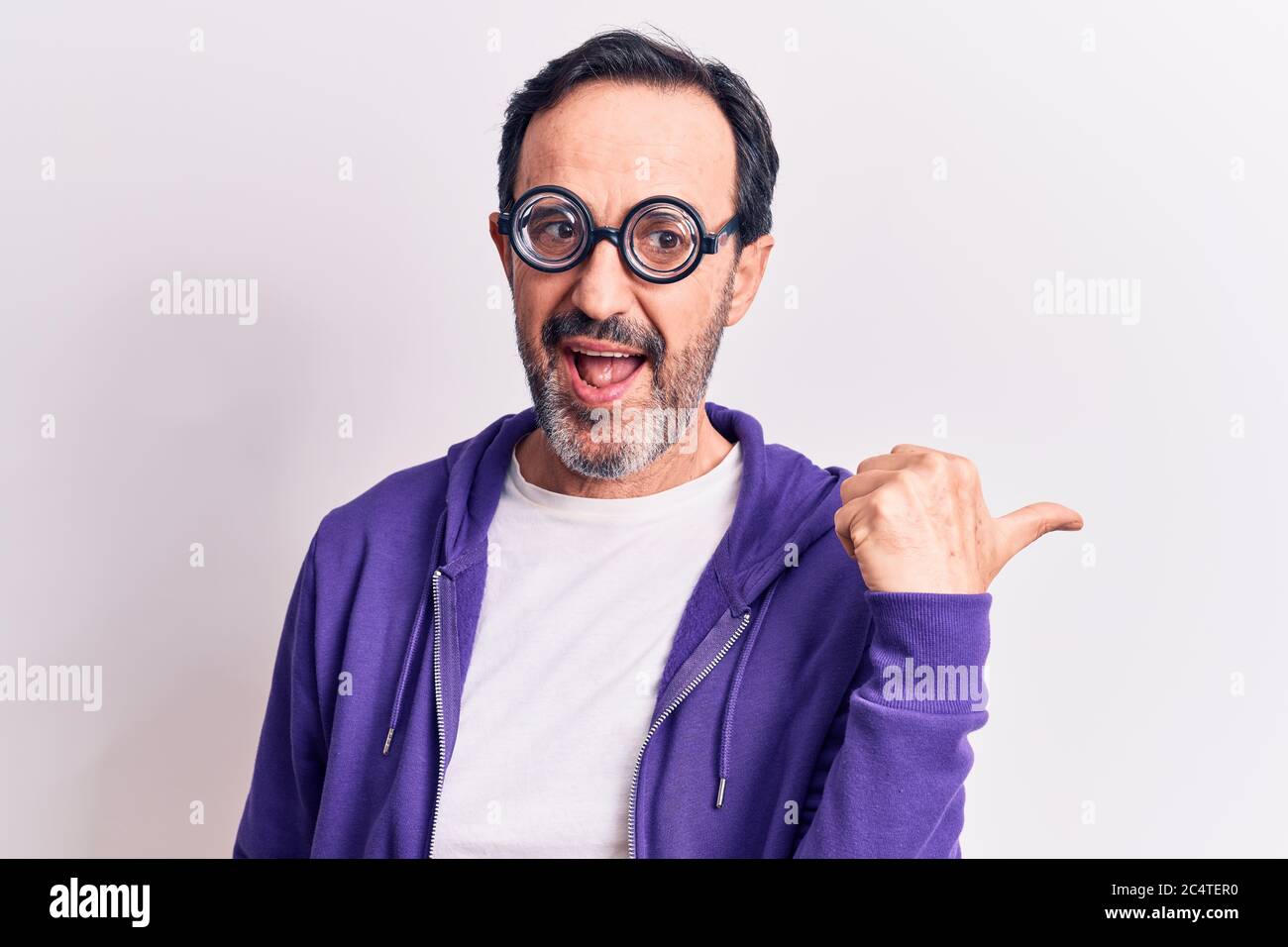 Middle age handsome freaky man wearing dumb glasses over isolated white ...
