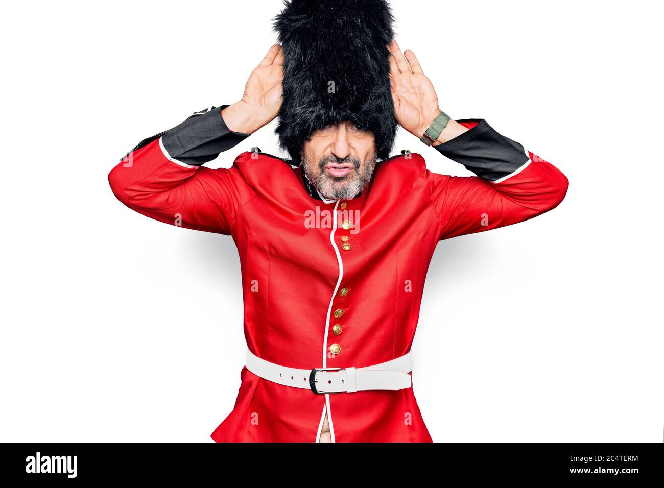 Middle age handsome wales guard man wearing traditional uniform over ...