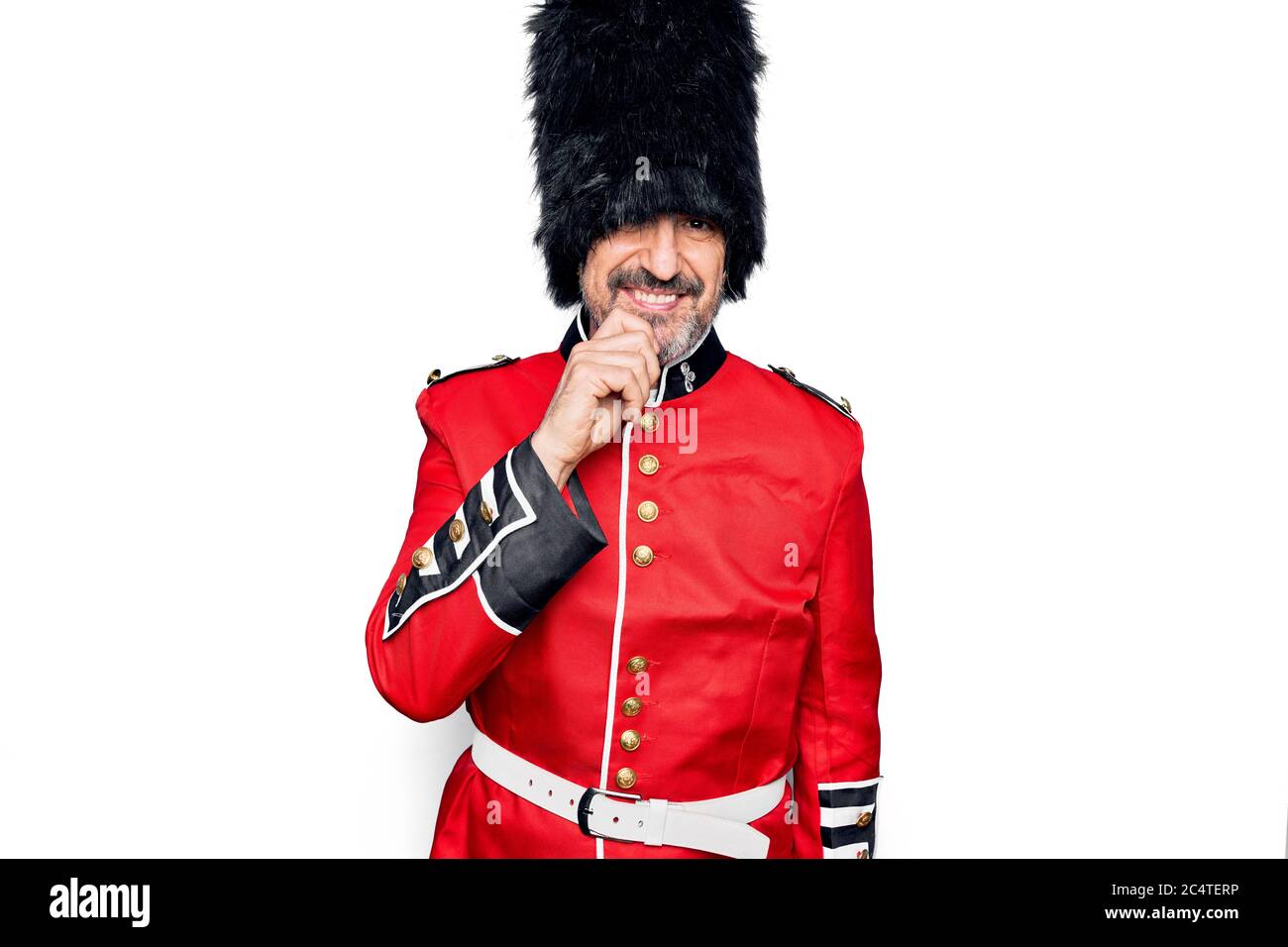Middle age handsome wales guard man wearing traditional uniform over ...