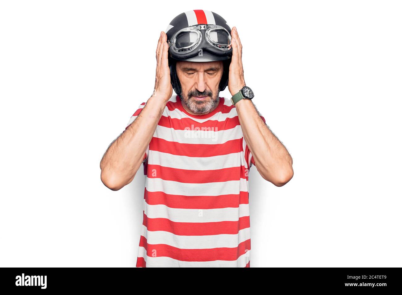 Middle age handsome motorcyclist man wearing moto helmet over isolated ...