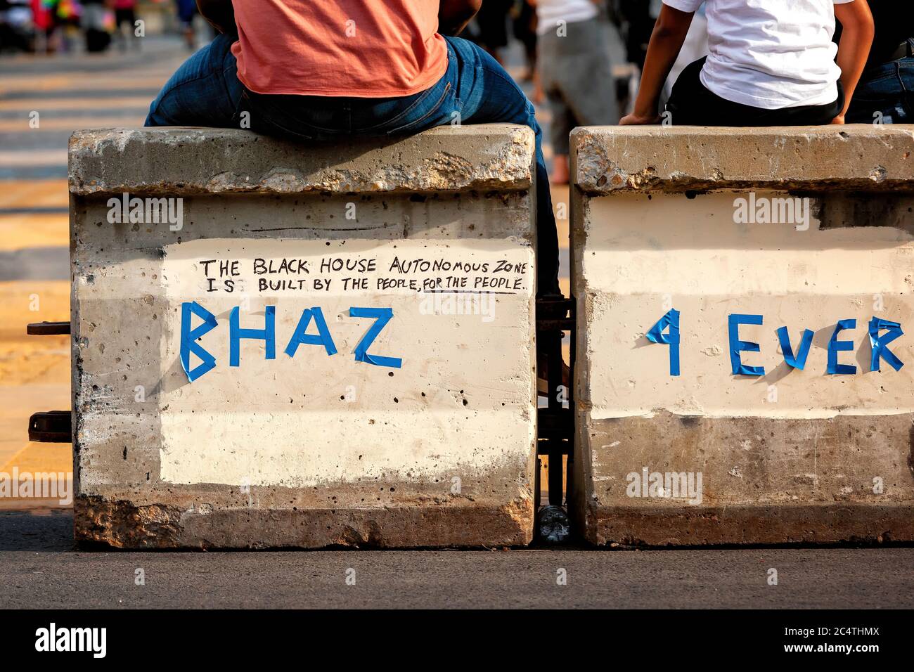 Sign on concrete barriers at Black Lives Matter Plaza reads "BHAZ 4 ...