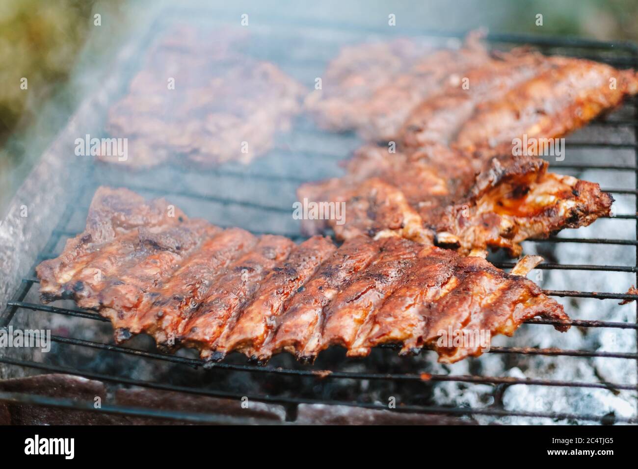 Cooking pork ribs on the grill Stock Photo - Alamy