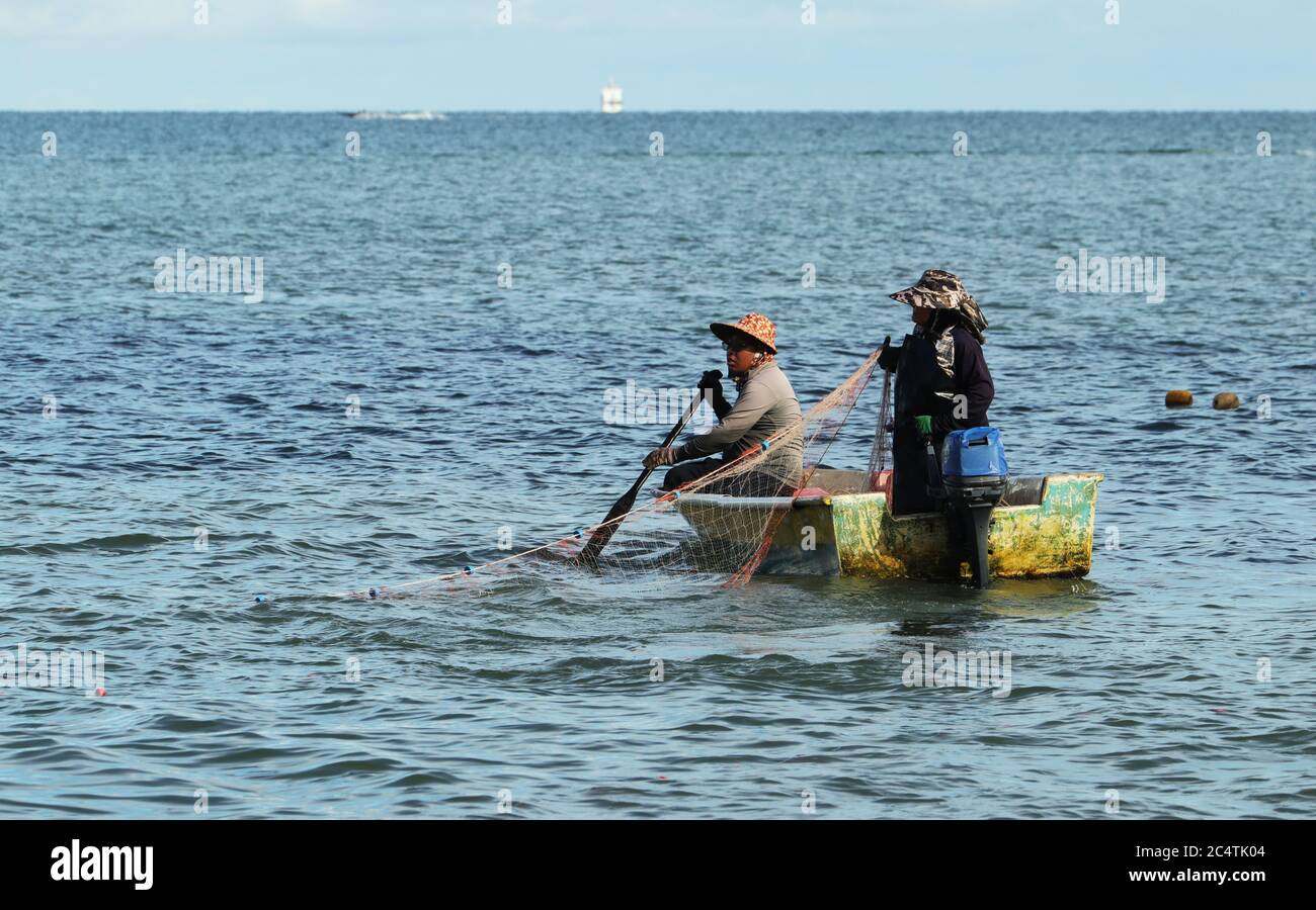 Small fishing boats and cargo ships in Likas Bay kota Kinabalu Sabah ...