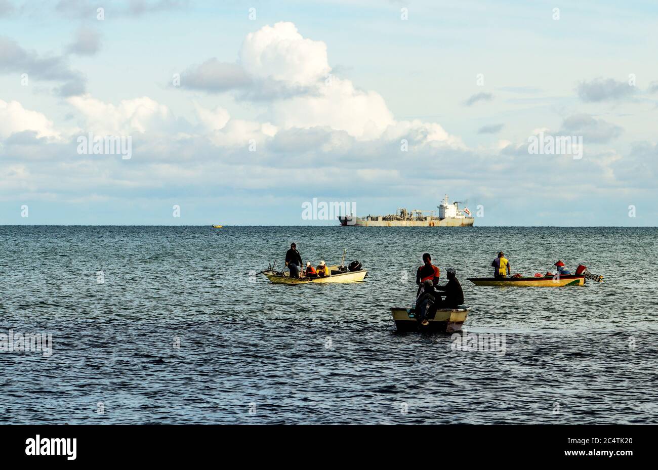 Small fishing boats and cargo ships in Likas Bay kota Kinabalu Sabah ...