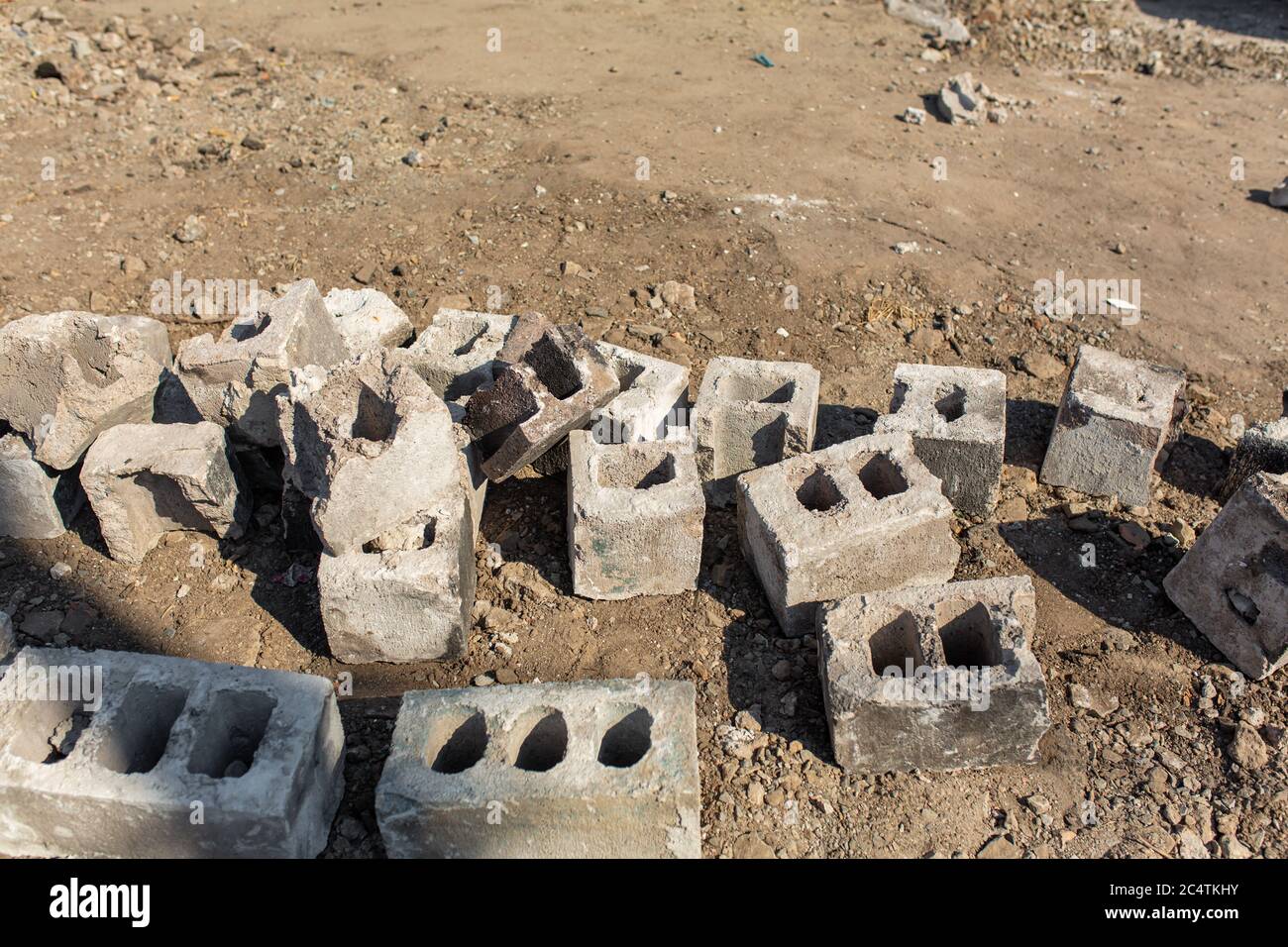 Cinder blocks are scattered on the ground Stock Photo - Alamy