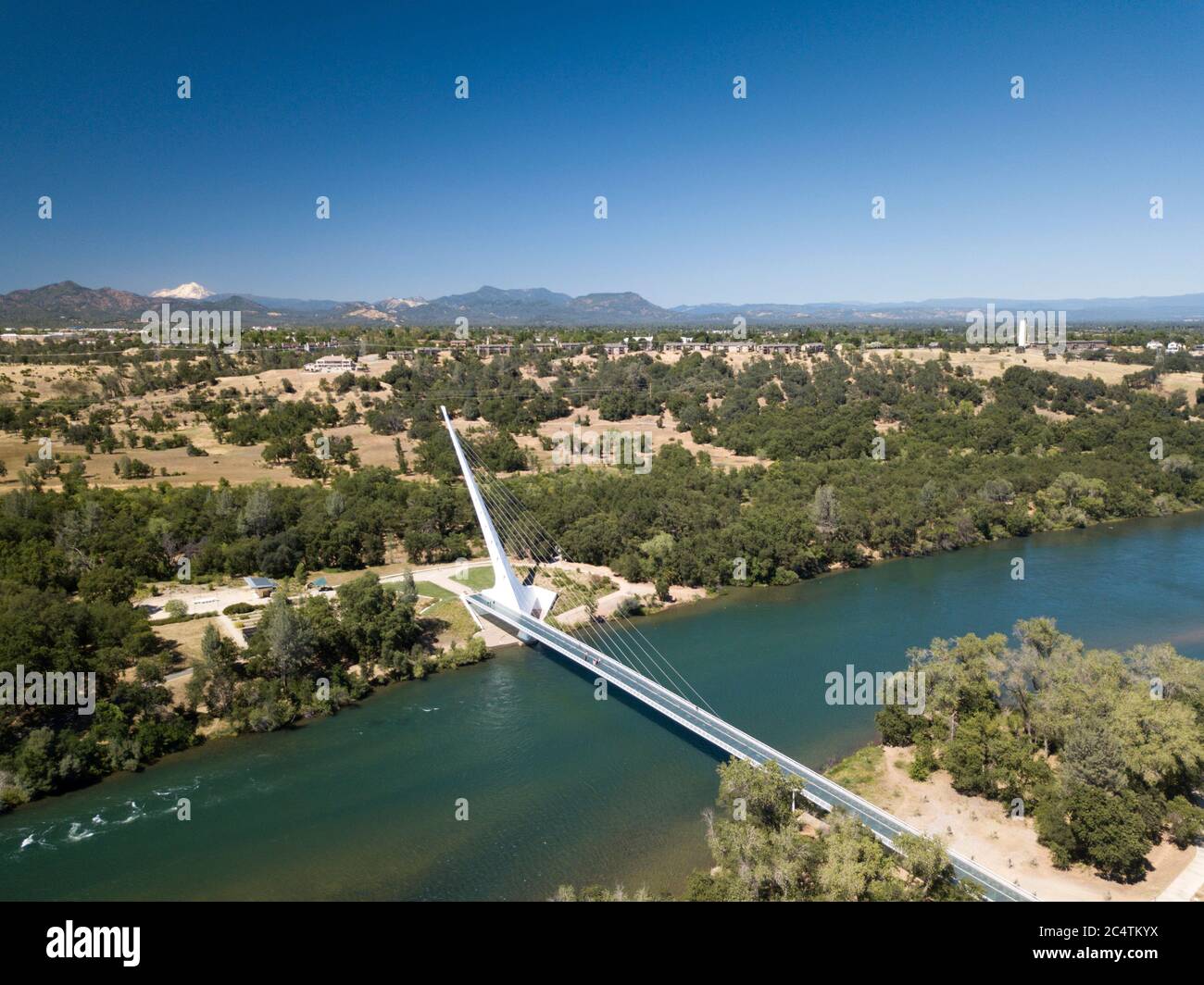Aerial views above the Sundial Bridge in Redding with Mt. Shasta in the ...