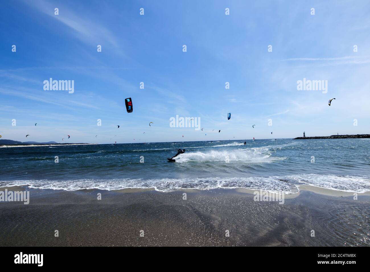 Wide angle shot of people windsurfing under the blue sky Stock Photo ...