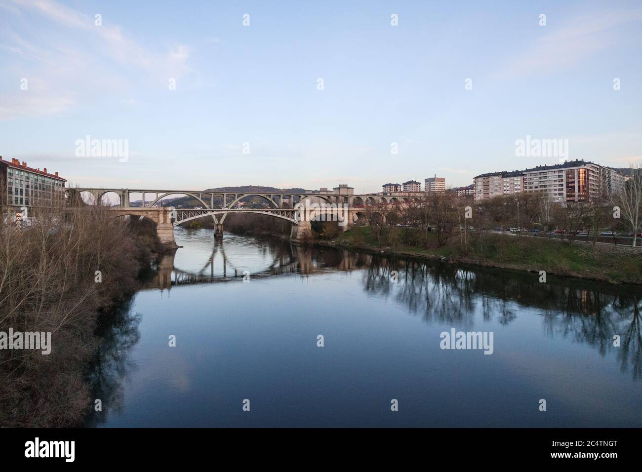 Bridges going over the river surrounded by buildings Stock Photo - Alamy
