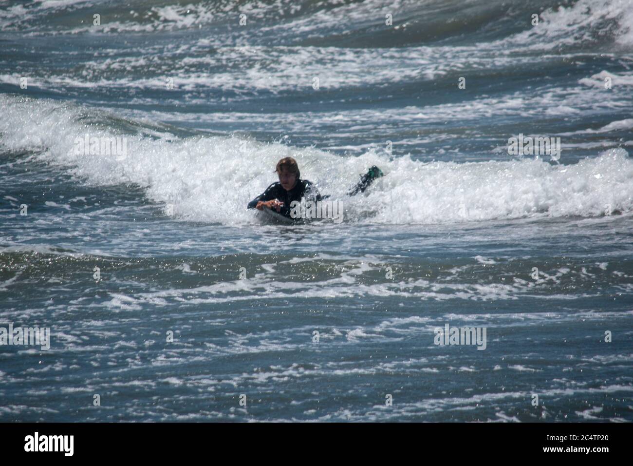 Men swimming with a wetsuit hi-res stock photography and images - Alamy