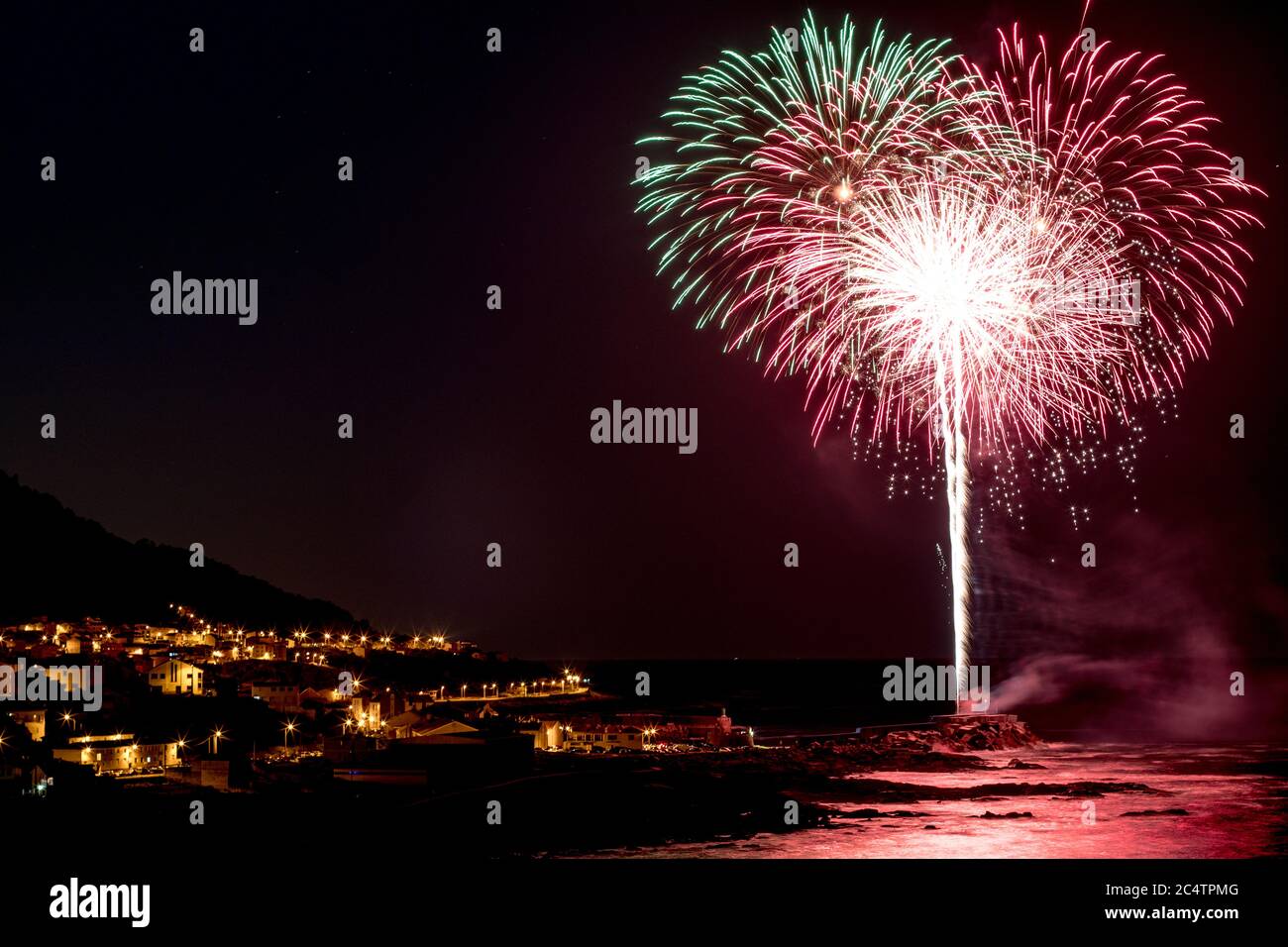 Multicolored fireworks exploding in the sky at night Stock Photo - Alamy