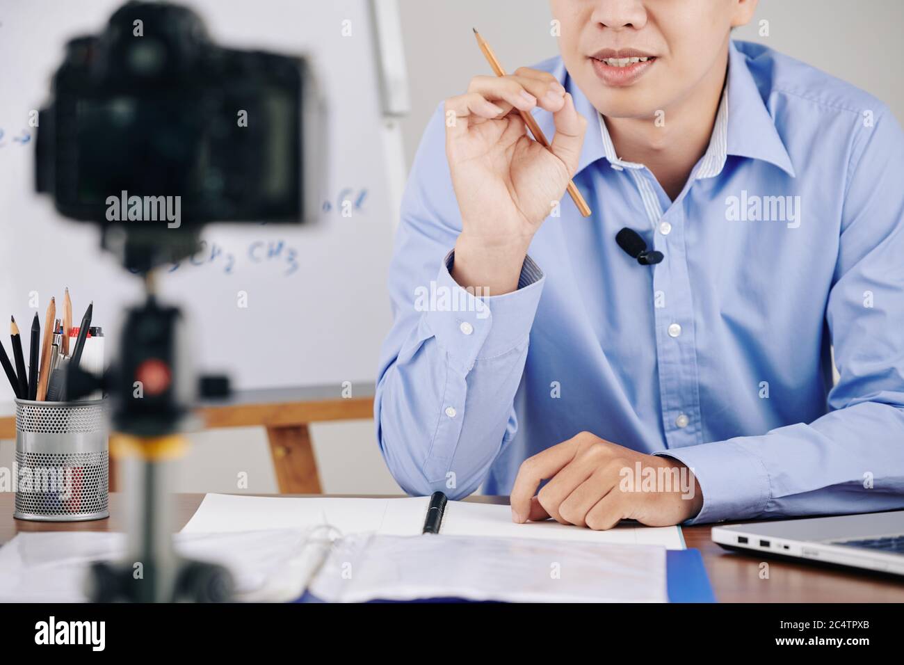 Cropped image of teacher recording lesson and explaining difficult ...