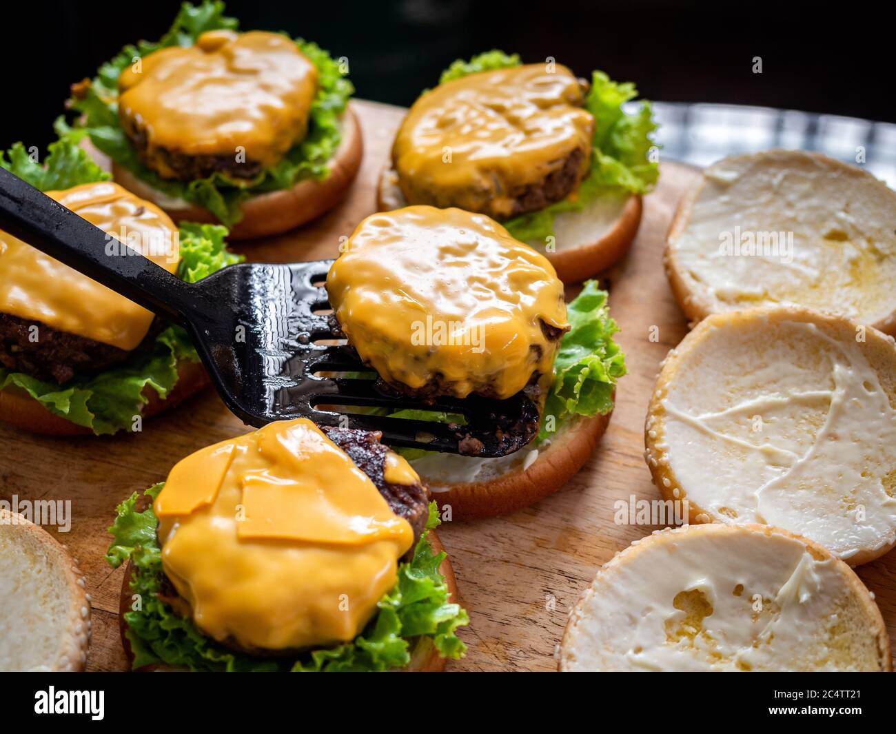 Burger making process hi-res stock photography and images - Alamy