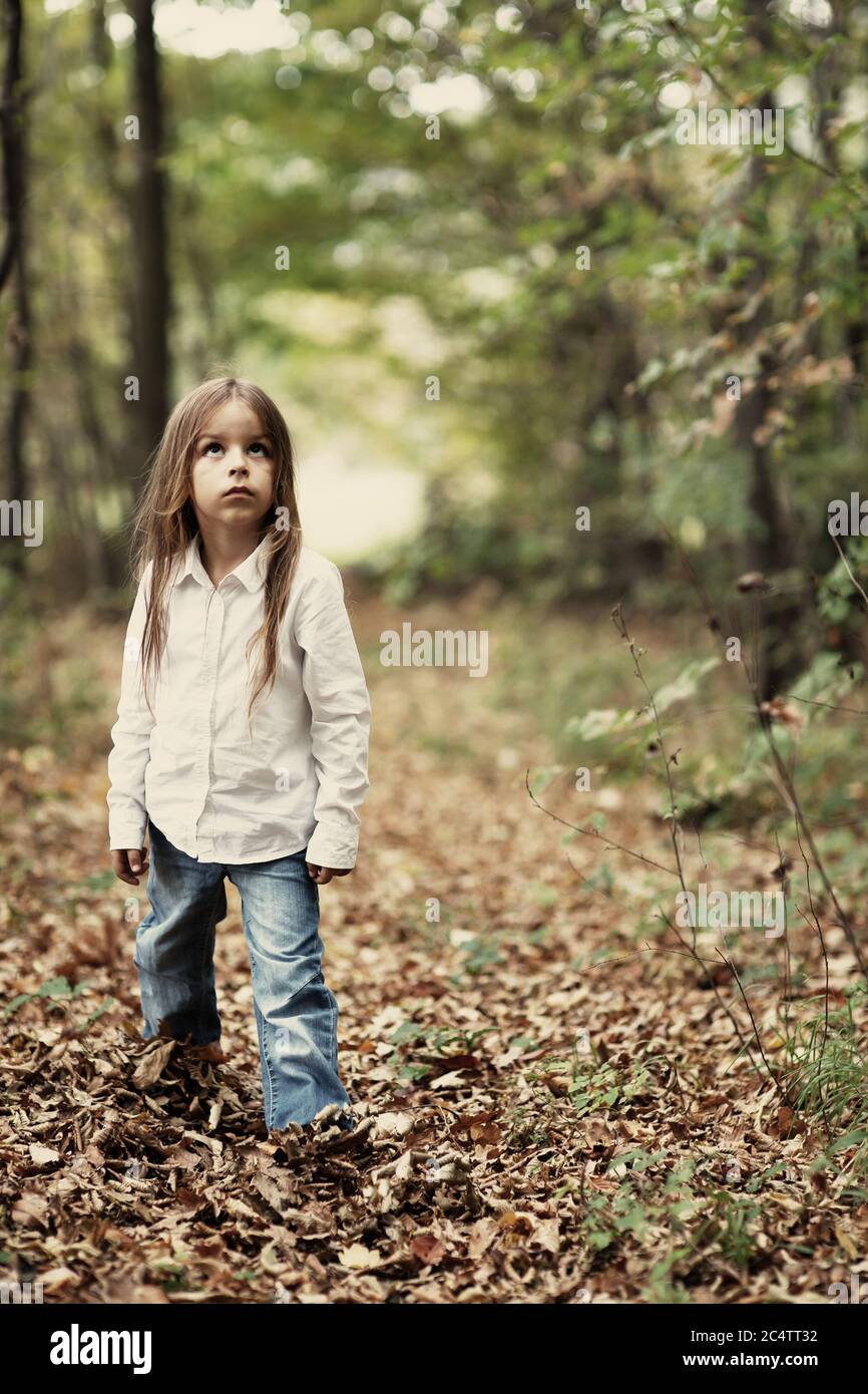 long-haired boy posing in the forest Stock Photo - Alamy
