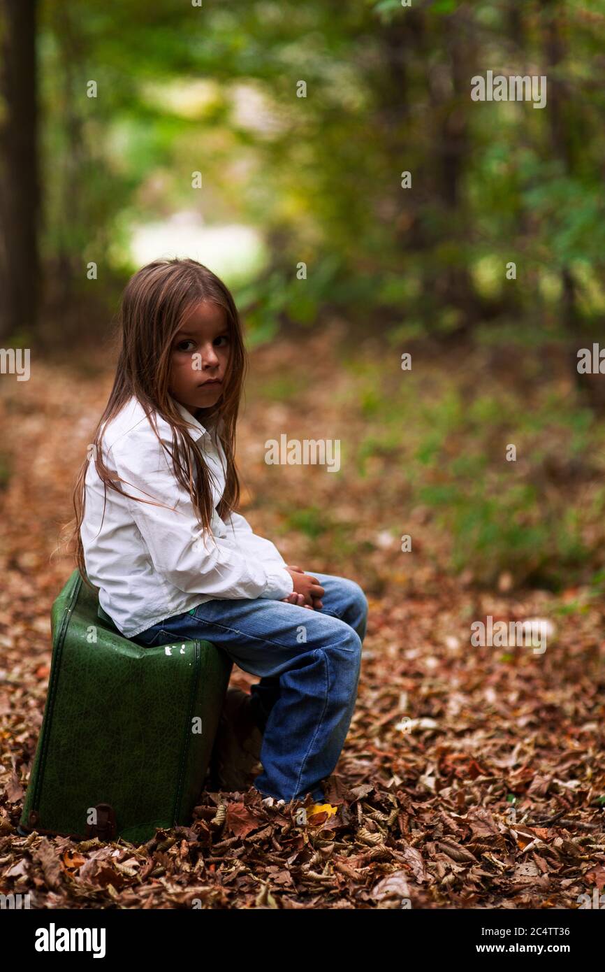 long-haired boy posing in the forest Stock Photo - Alamy
