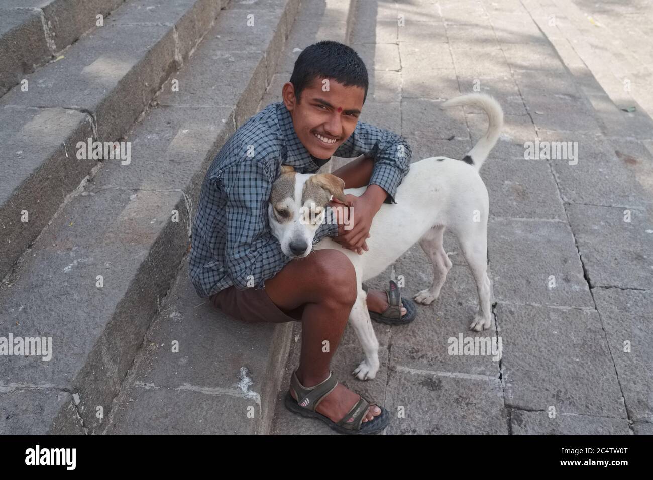 Indian boy and dog hi-res stock photography and images - Alamy