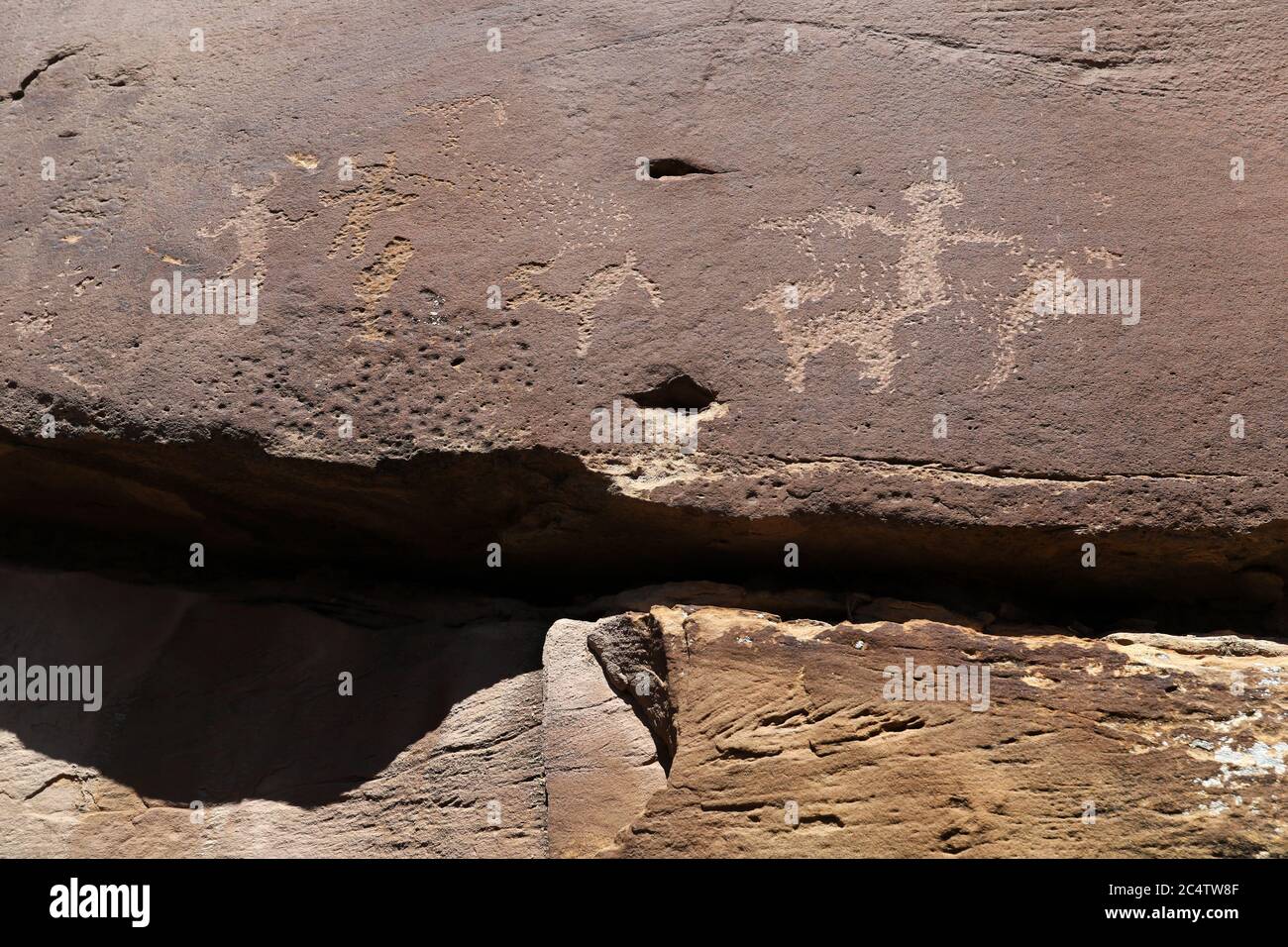 Native American Indian rock petroglyph sheep hunters Utah 1392. Nine ...