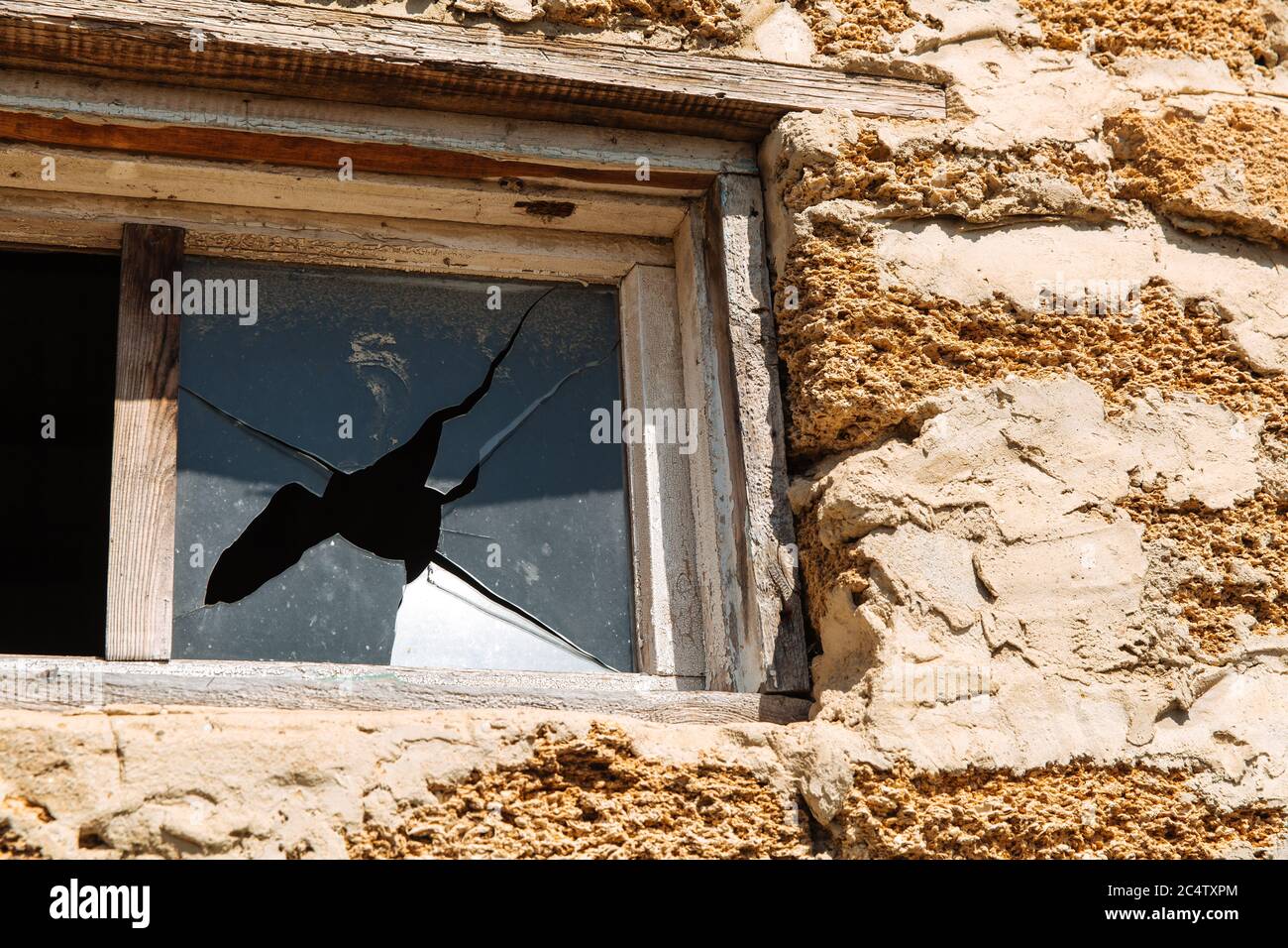 Broken glass in a building window. Housing problems Stock Photo - Alamy