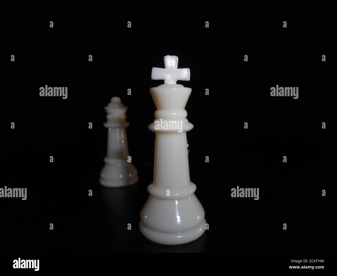 Chess photographed on portrait of black background Stock Photo - Alamy