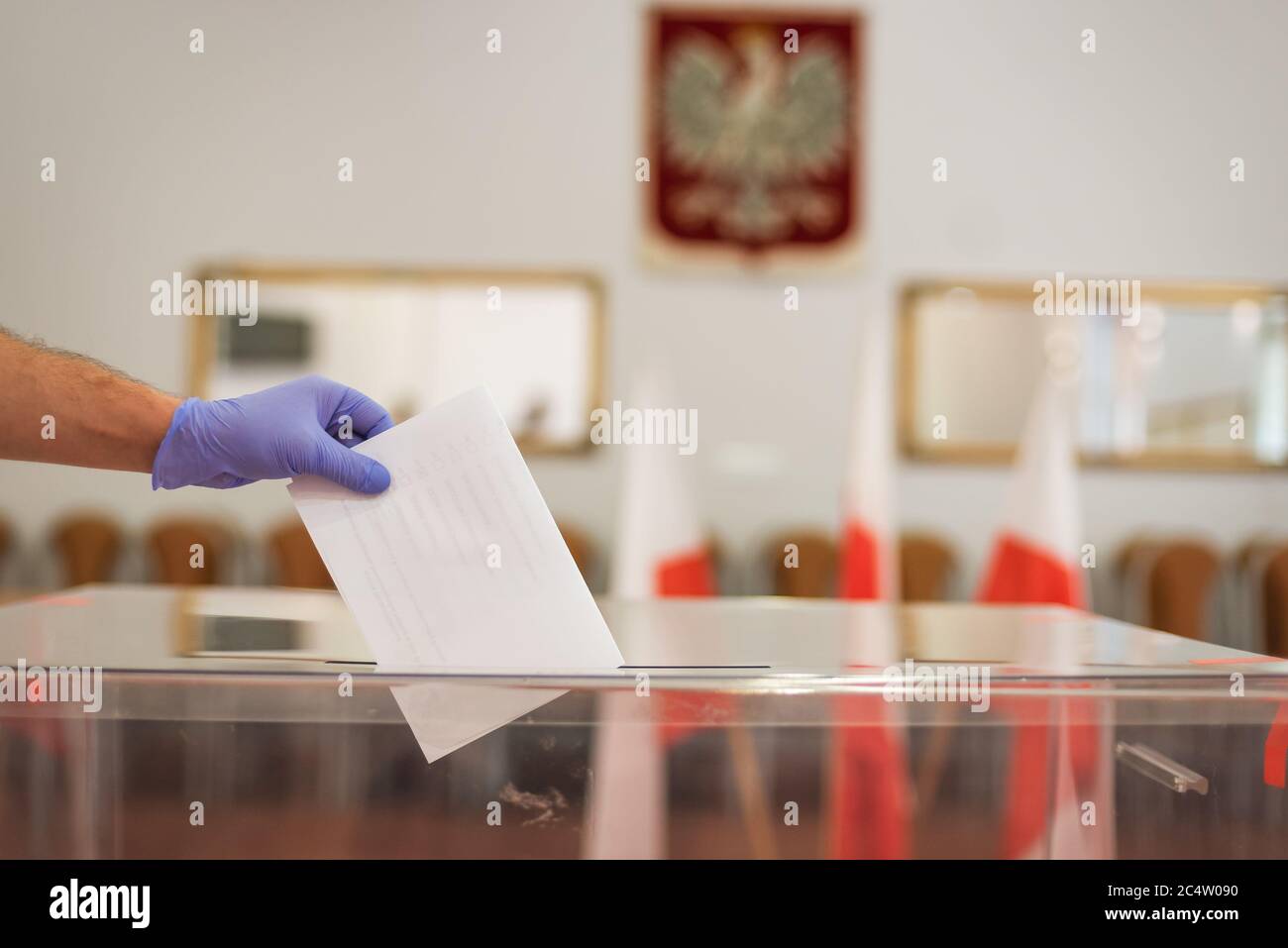 Throwing a card with a vote to the ballot box during elections. In the ...