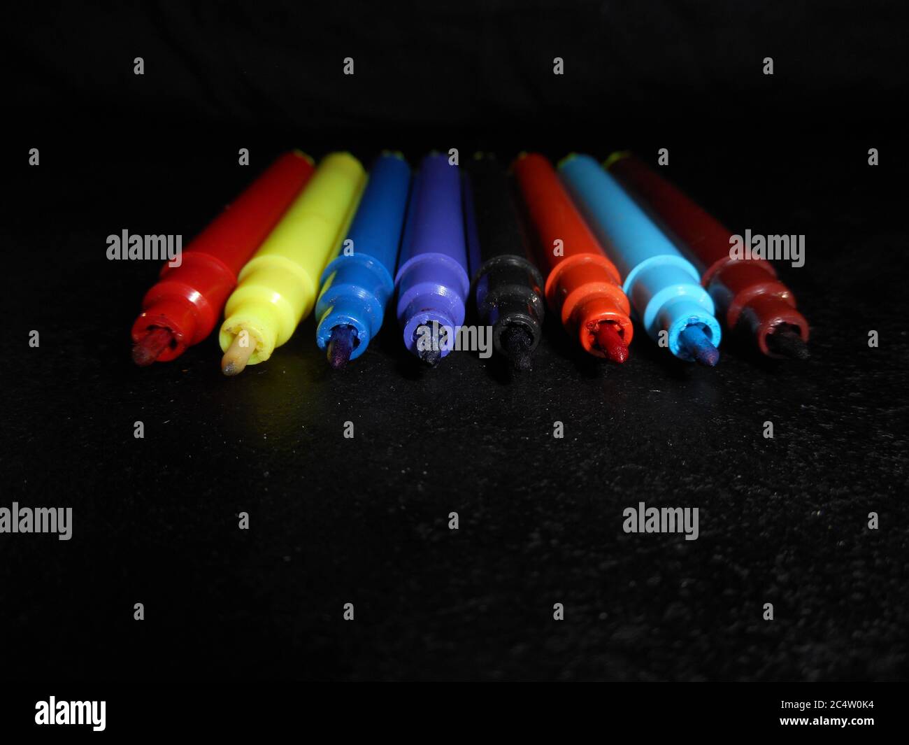 Colorful marker pen set on black background Stock Photo - Alamy