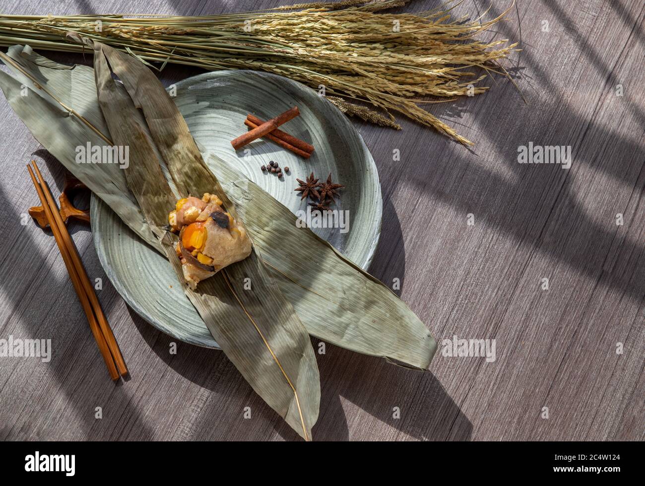 Chinese rice dumpling (Zongzi) shaped pyramidal wrapped by leaves ...