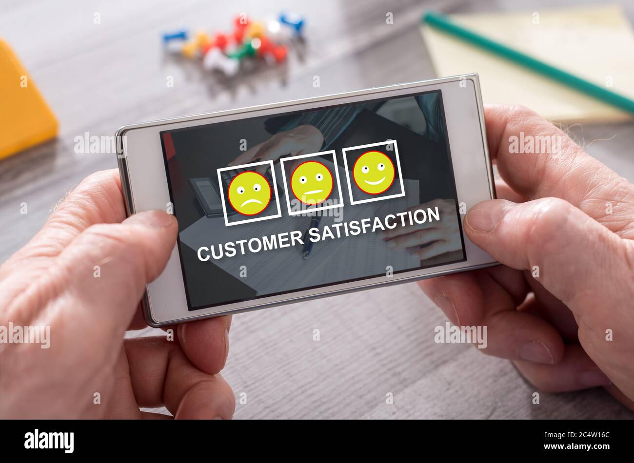 Customer satisfaction concept on mobile phone Stock Photo - Alamy