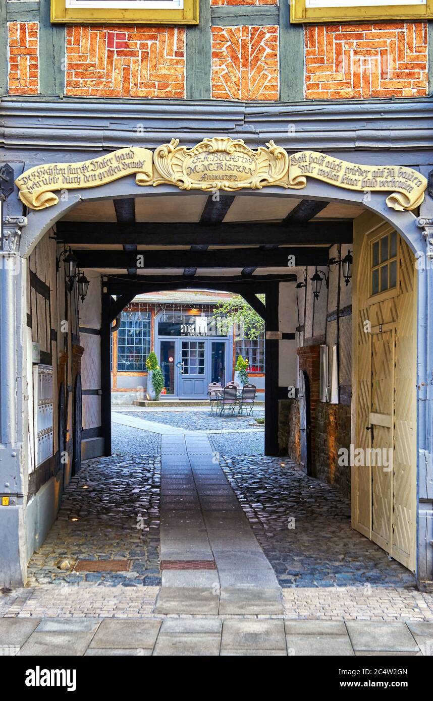 View through an old archway to a back yard Stock Photo - Alamy