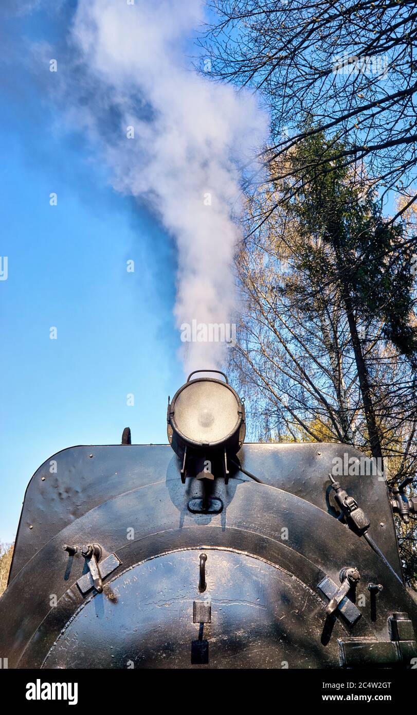 Steam rises from an old black steam locomotive Stock Photo - Alamy