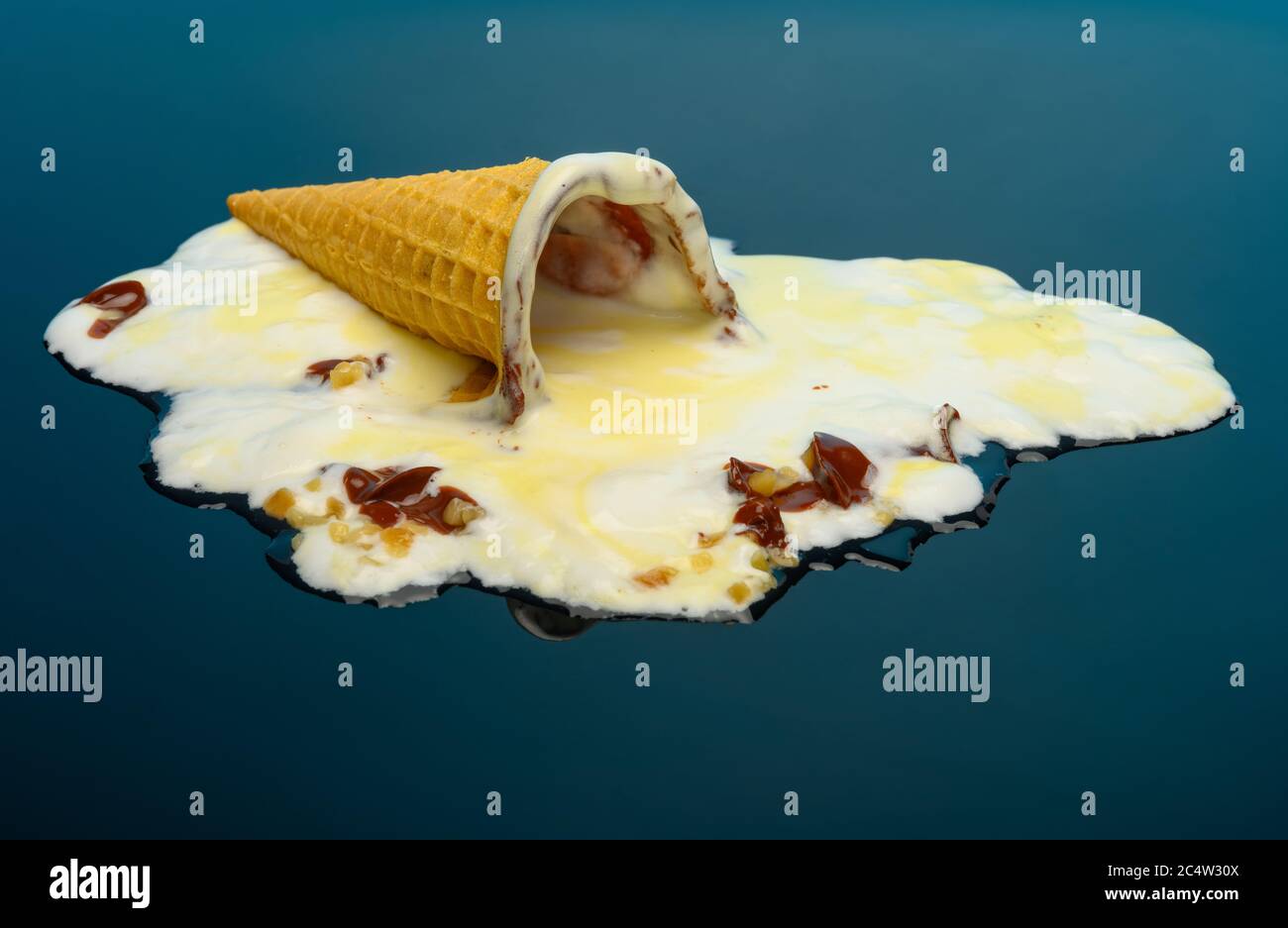 vanilla flavor ice cream cone melted on glass Stock Photo - Alamy