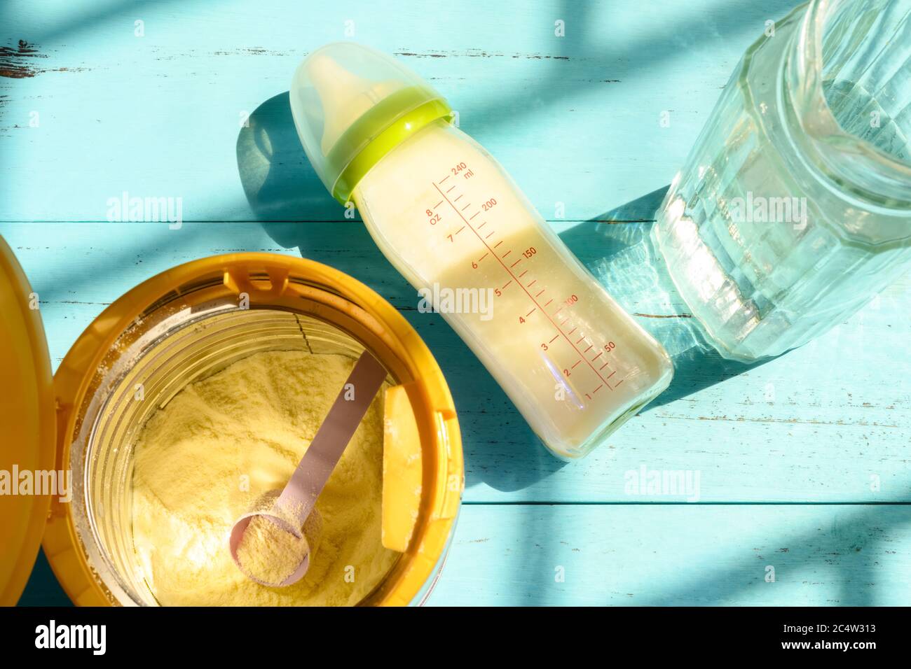 Preparation preparing powdered milk in hi-res stock photography and ...