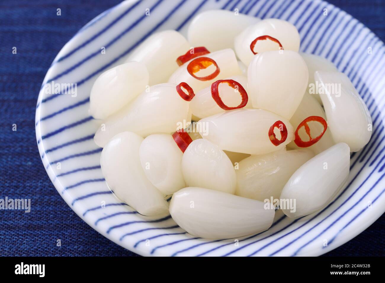 Japanese Rakkyo, Sweet and sour pickled scallions in a dish Stock Photo ...