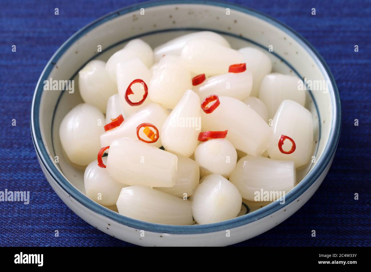 Japanese Rakkyo, Sweet and sour pickled scallions in a dish Stock Photo ...